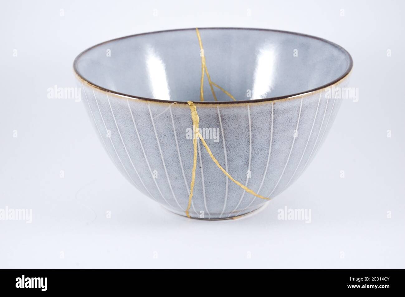 Gray Kintsugi bowl, real gold restoration, japanese technique Stock ...