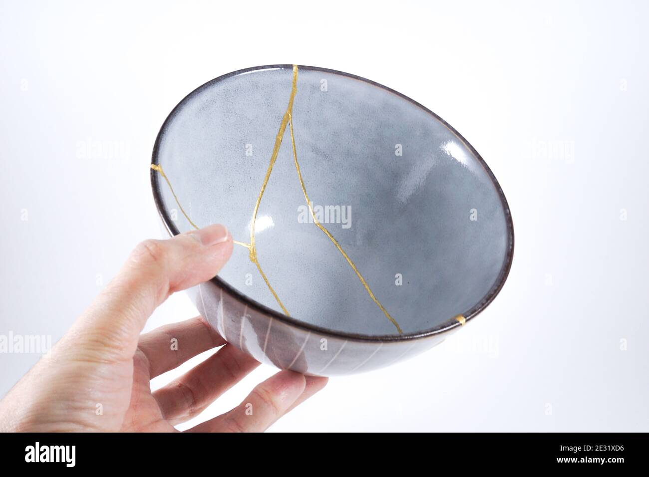 Gray Kintsugi bowl, real gold restoration, japanese technique Stock ...