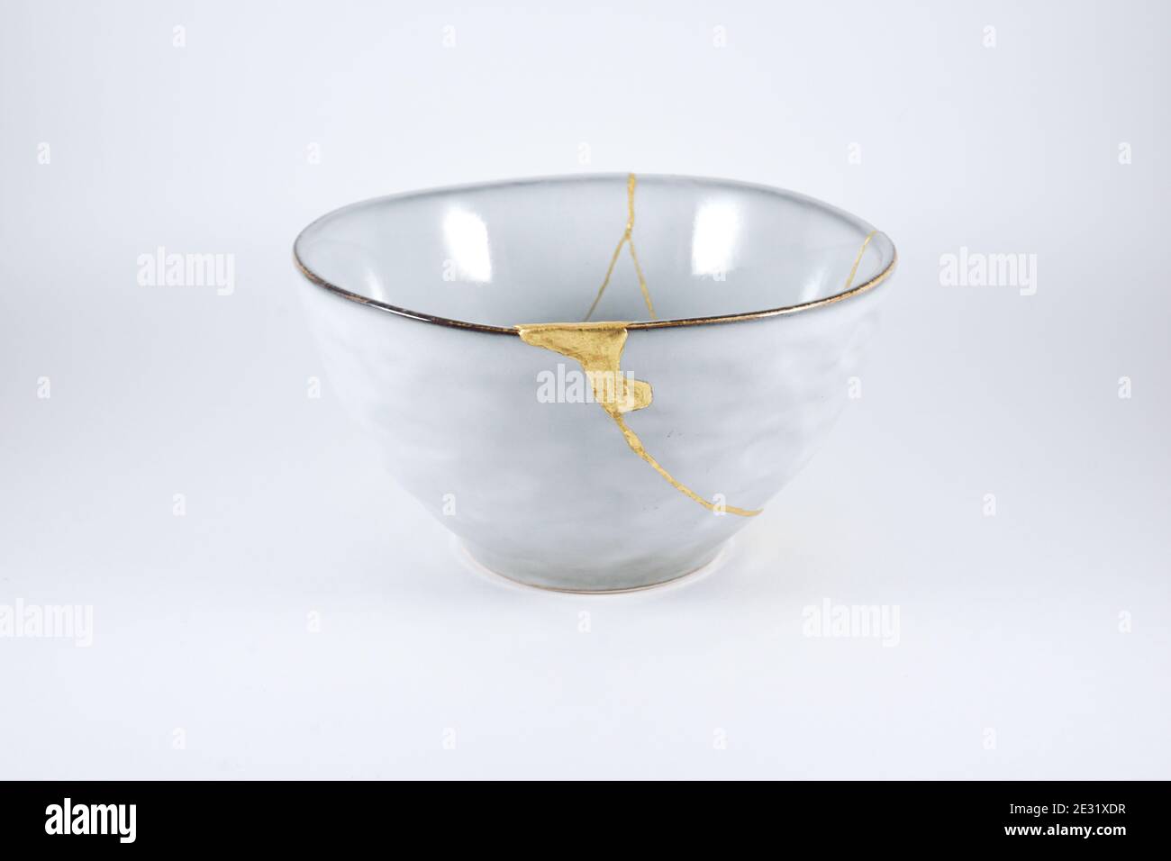 Gray Kintsugi bowl, real gold restoration, japanese technique Stock ...