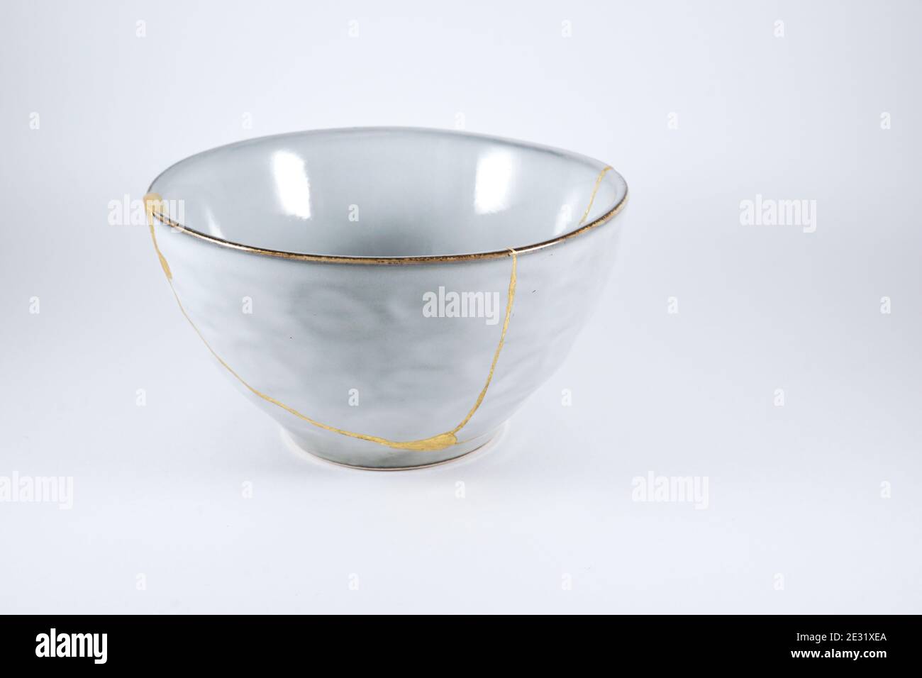 Gray Kintsugi bowl, real gold restoration, japanese technique Stock ...