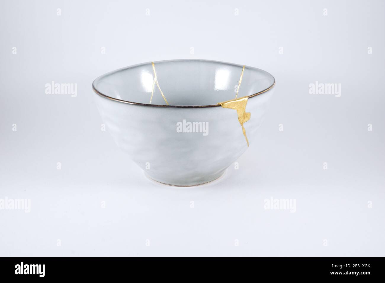 Gray Kintsugi bowl, real gold restoration, japanese technique Stock ...