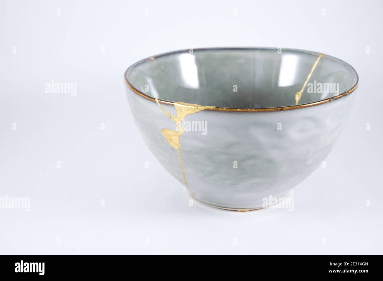 Gray Kintsugi bowl, real gold restoration, japanese technique Stock ...