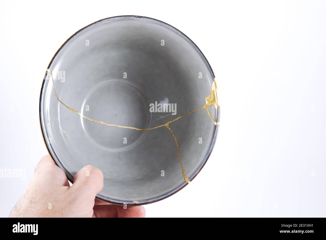 Gray Kintsugi bowl, real gold restoration, japanese technique Stock ...