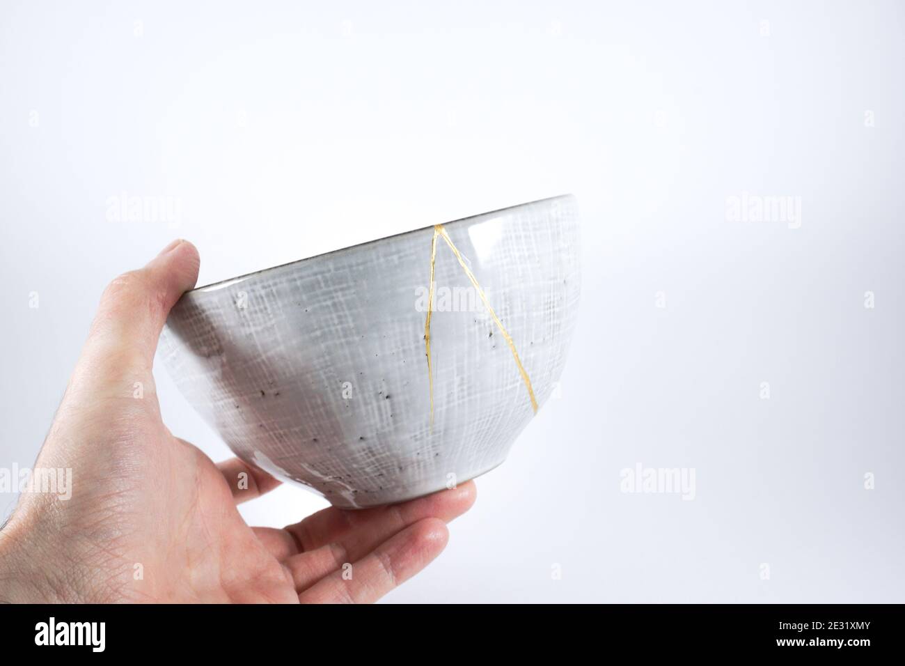 Gray Kintsugi bowl, real gold restoration, japanese technique Stock ...