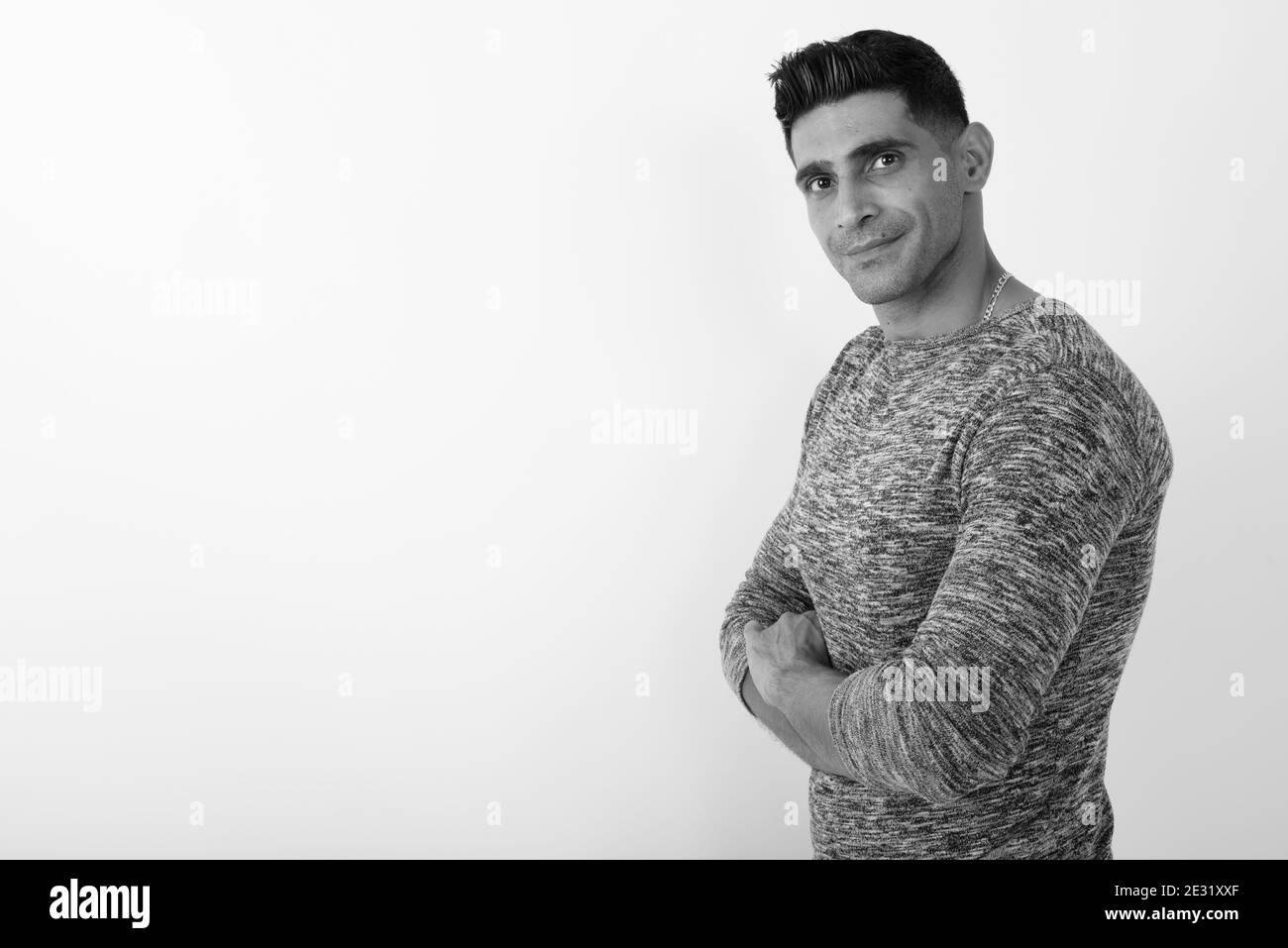 Young muscular Persian man against white background Stock Photo - Alamy