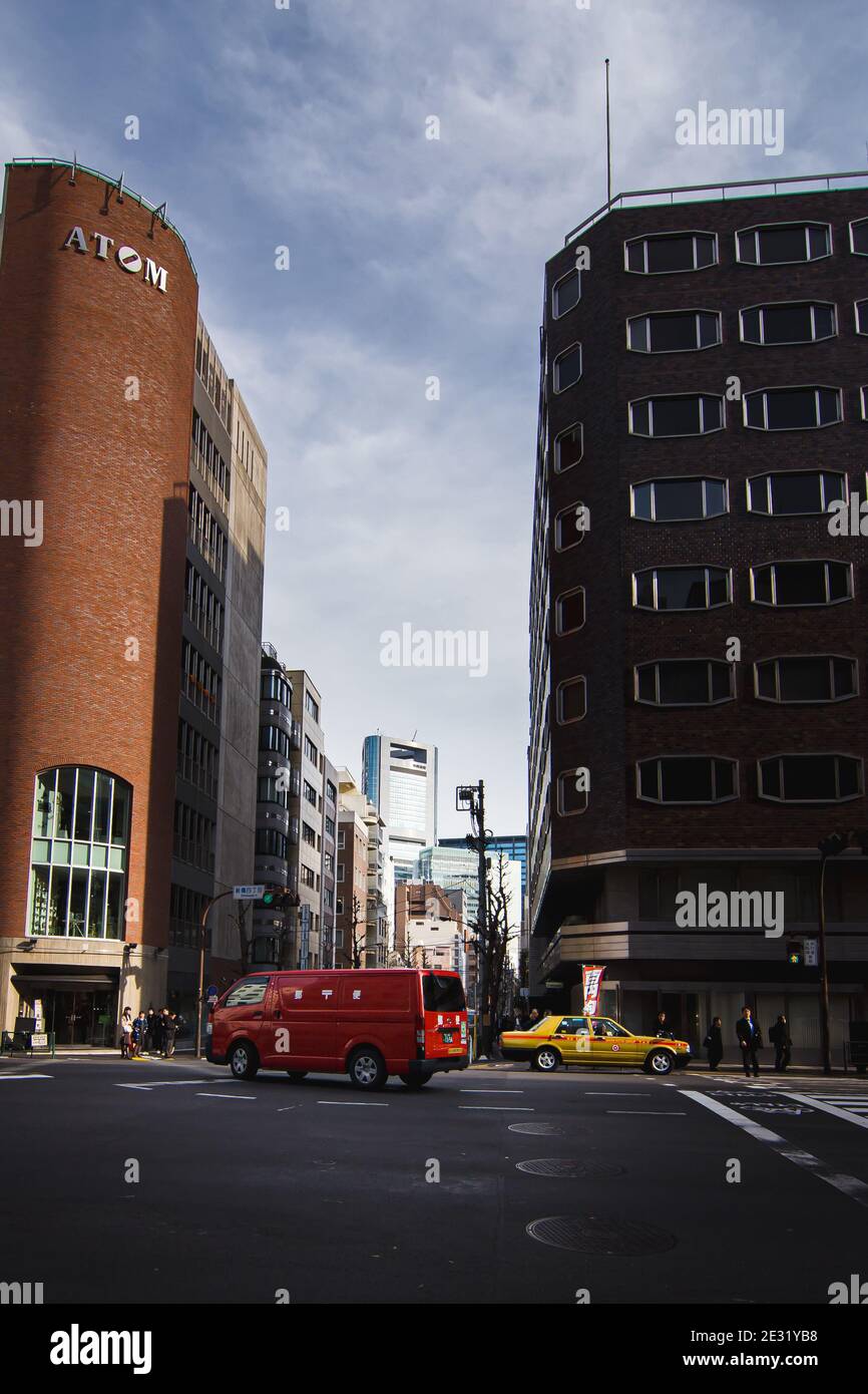 Japanese Postal Van and Taxi Crossing an Intersection in Tokyo J Stock ...