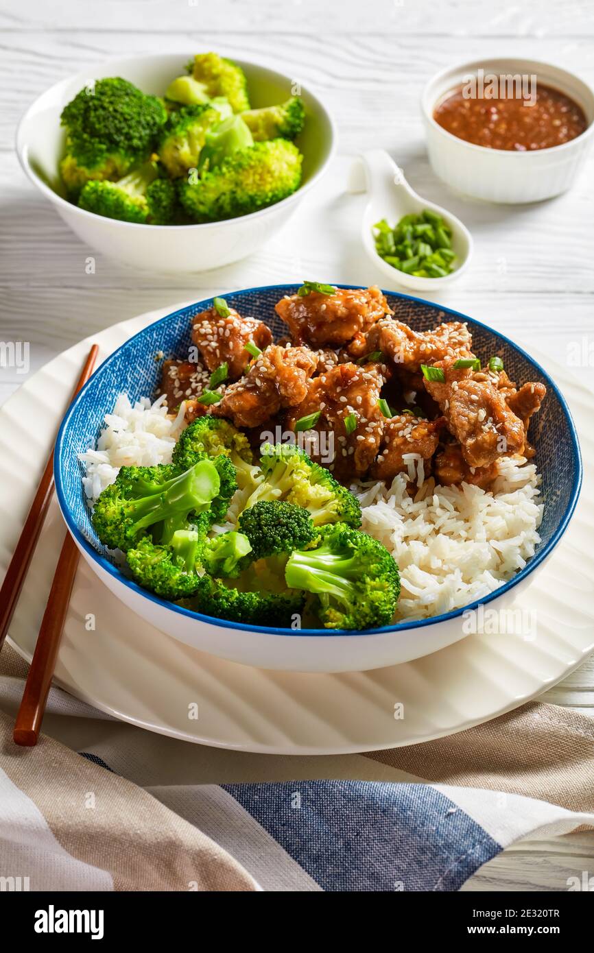 General Tso’s Chicken crispy Chinese chicken bites in a bowl with rice ...