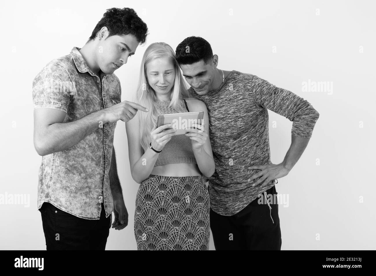 Three multi-ethnic friends together against white background Stock ...