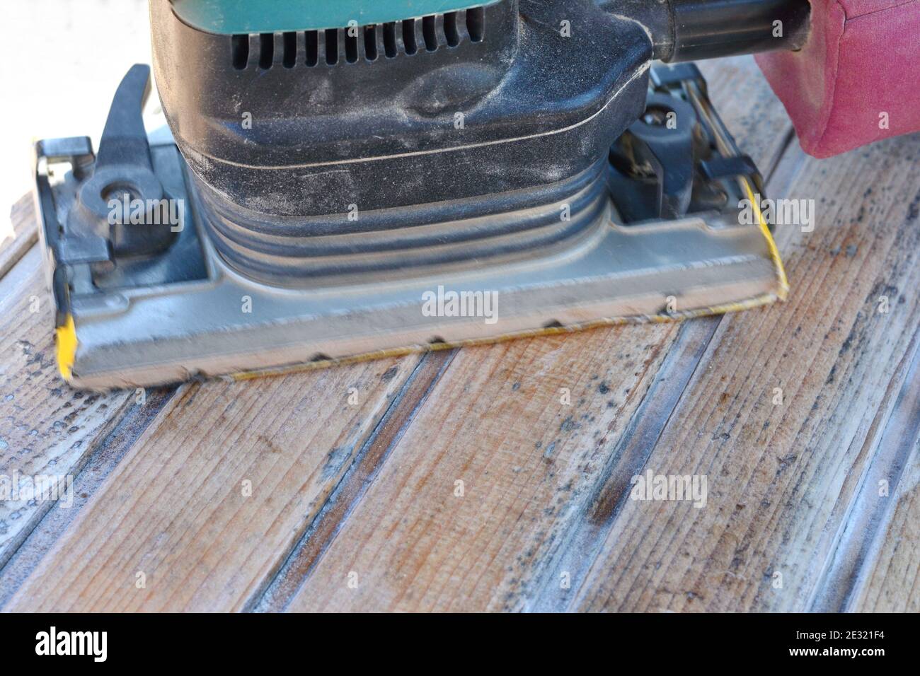 The polished wood working. Carpenter workspace refining the surface of ...