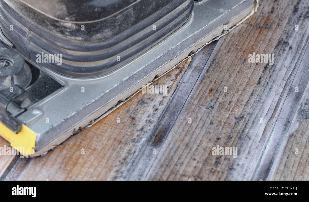 The polished wood working. Carpenter workspace refining the surface of ...