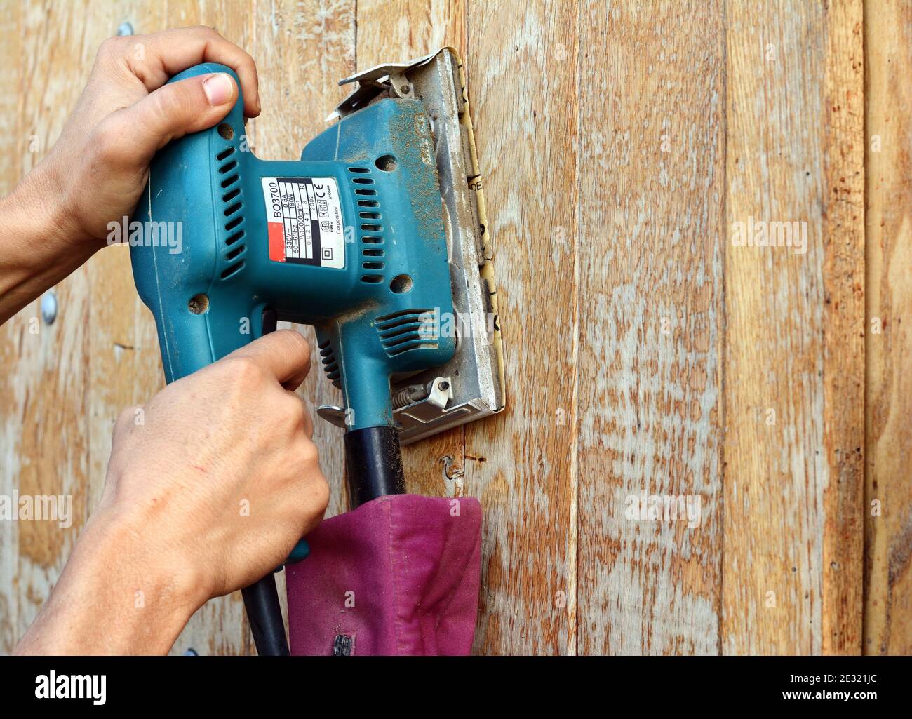 The polished wood working. Carpenter workspace refining the surface of ...
