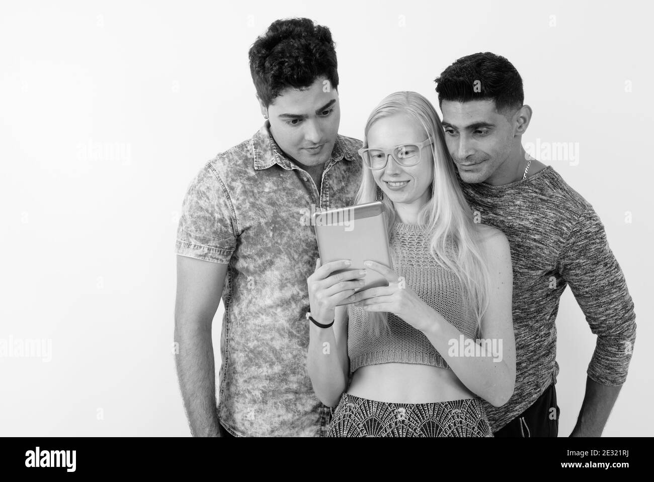 Three multi-ethnic friends together against white background Stock ...
