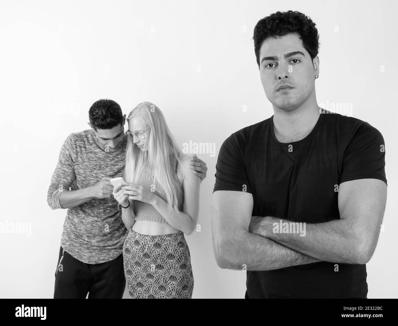 Three multi-ethnic friends together against white background Stock ...