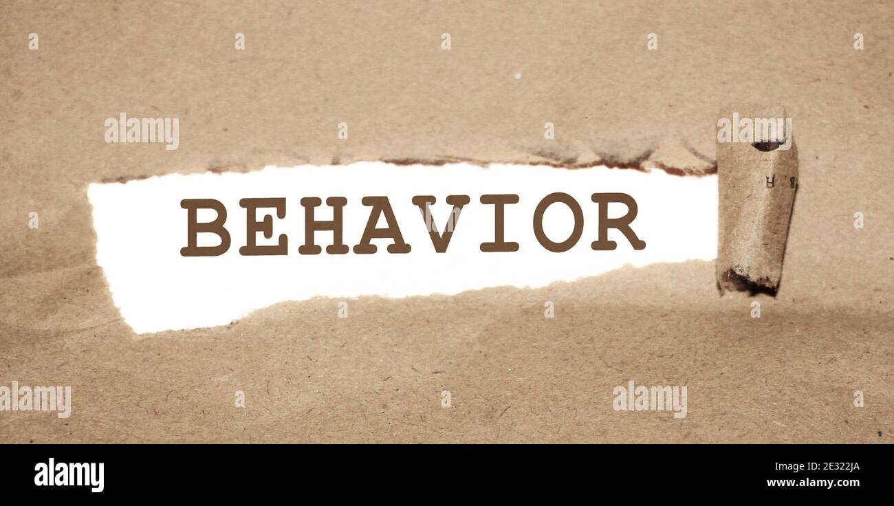 Behavior word written under brown torn paper Stock Photo - Alamy