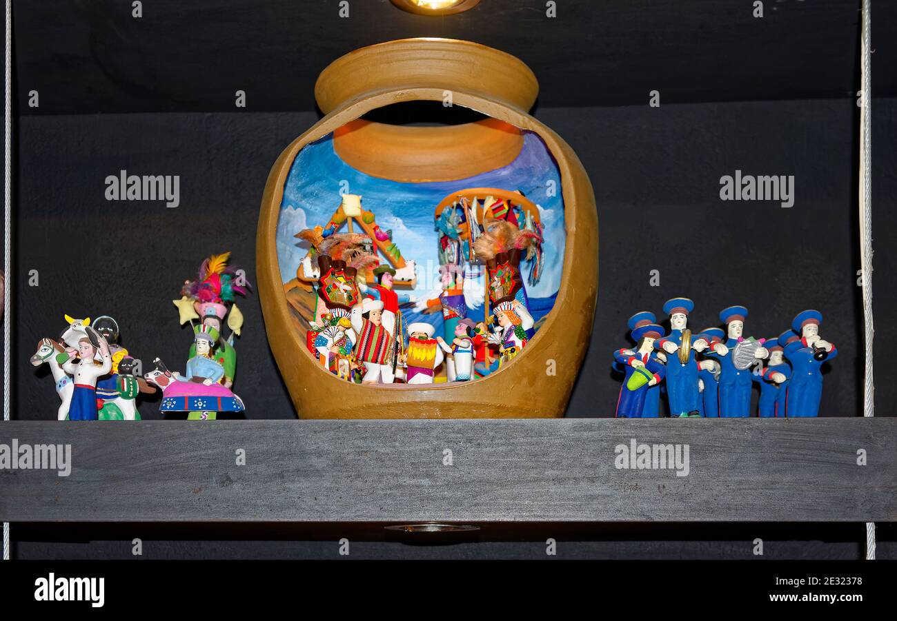 display; small figures, Indigenous, inside cutout jar, black background ...