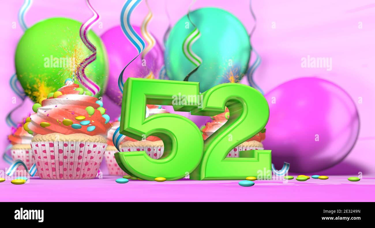 Birthday cupcake with sparking candle with the number 52 large in green ...