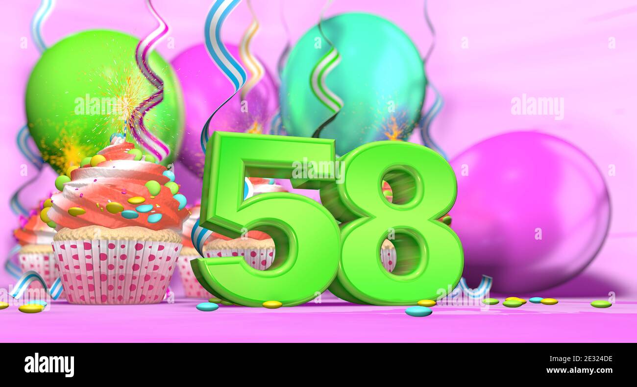 Birthday cupcake with sparking candle with the number 58 large in green ...
