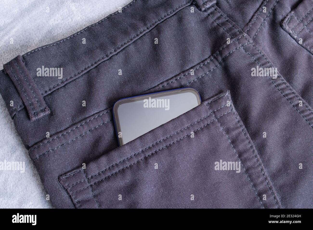 Phone in pocket worn hi-res stock photography and images - Alamy