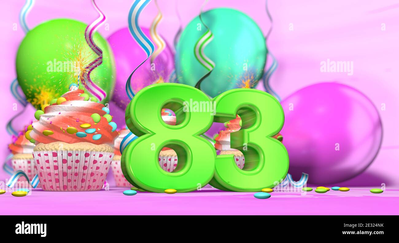 Birthday cupcake with sparking candle with the number 83 large in green ...
