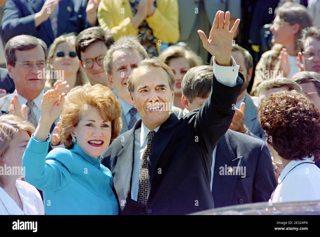 U.S. Senator Bob Dole, center, and his wife Elizabeth Dole wave as they ...