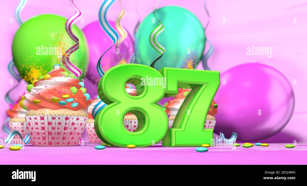 Birthday cupcake with sparking candle with the number 87 large in green ...