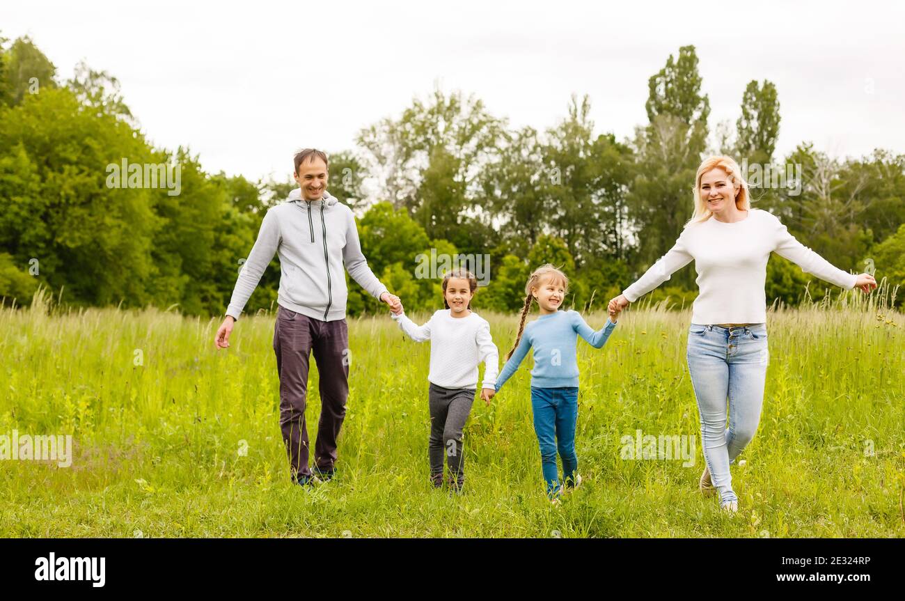 Woman two children enjoying walk hi-res stock photography and images ...