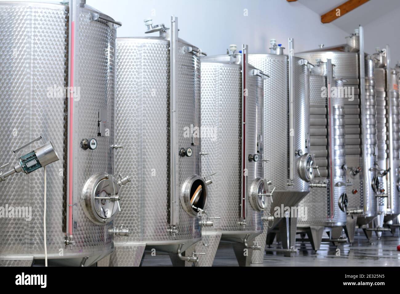 Modern wine factory with new large tanks for the fermentation. modern ...