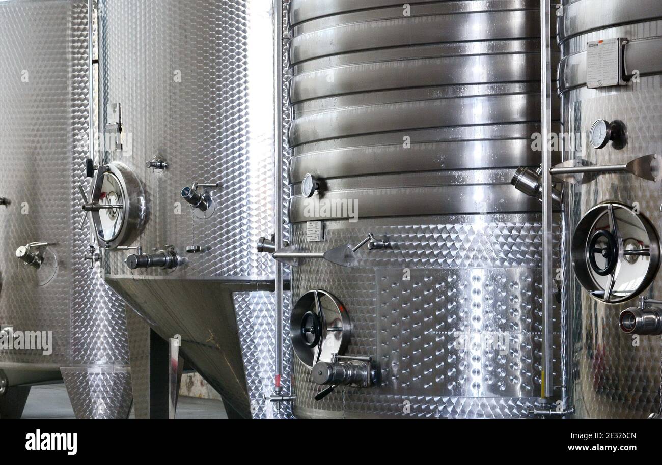 Modern wine factory with new large tanks for the fermentation. modern ...