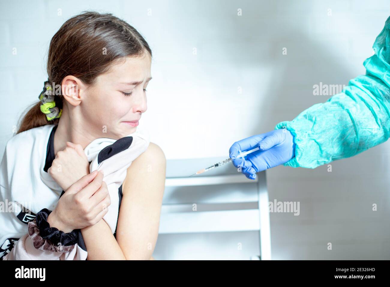 Girl crying when vaccinated. Prevention concept Stock Photo - Alamy