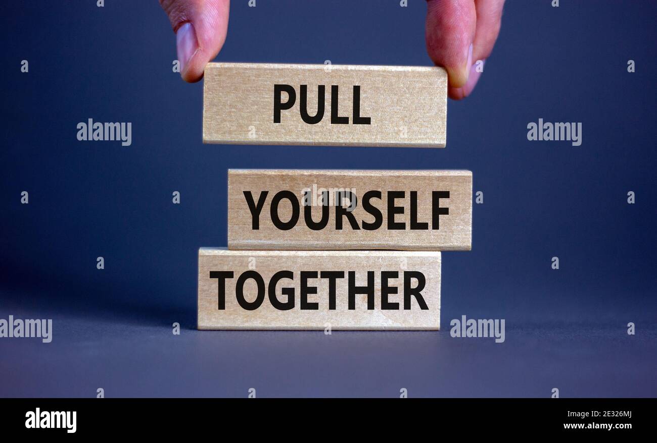 Pull yourself together symbol. Wooden blocks with words 'Pull yourself ...