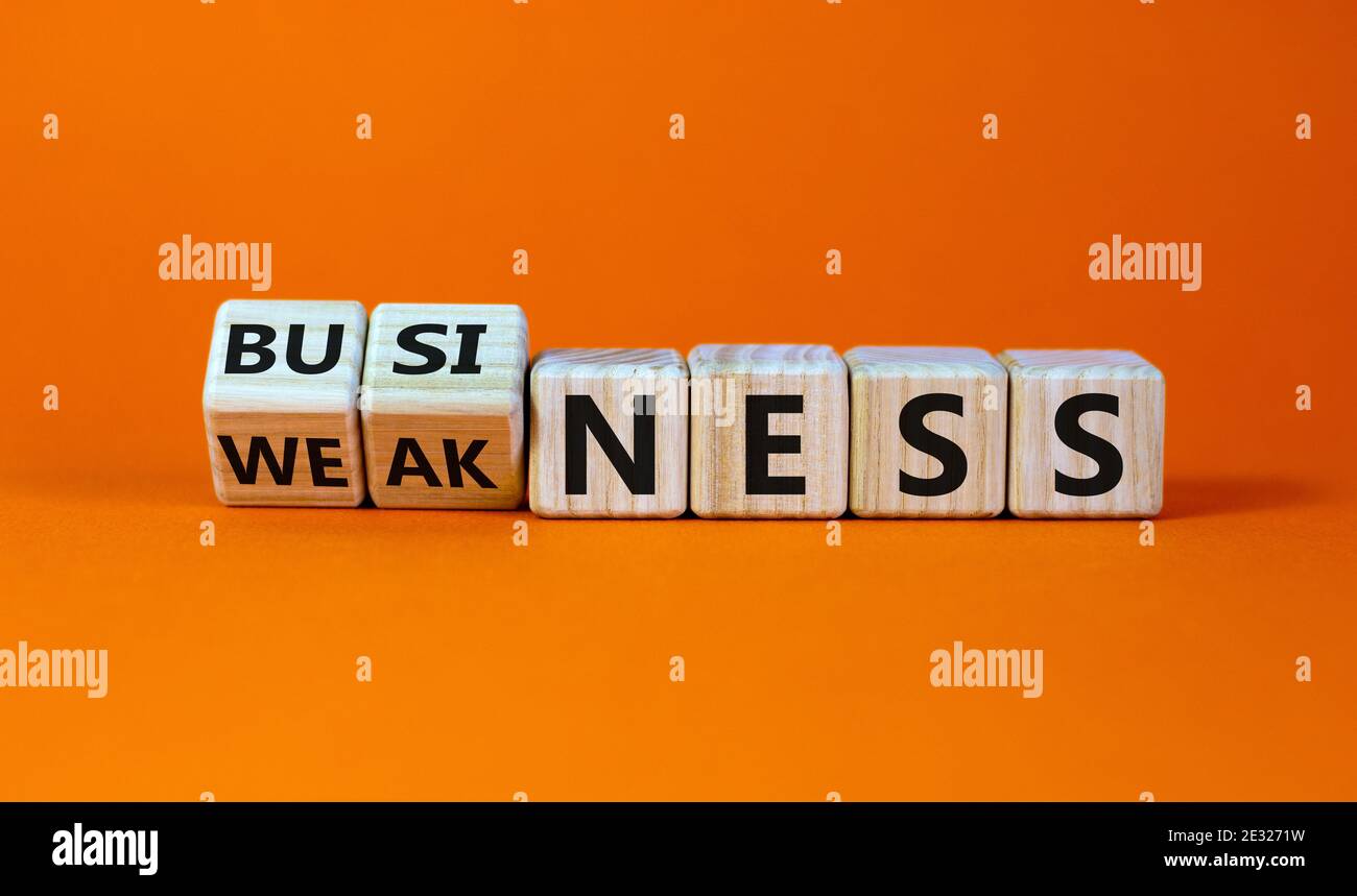 Business or weakness symbol. Turned wooden cubes and changed the word ...