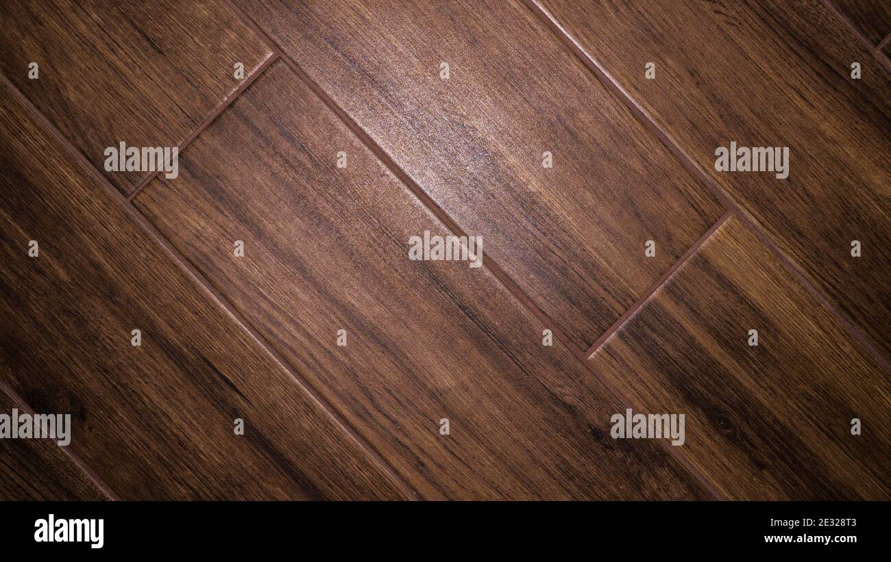 Matt tiles, walnut-like floor tiles, wood texture. The floor is covered ...