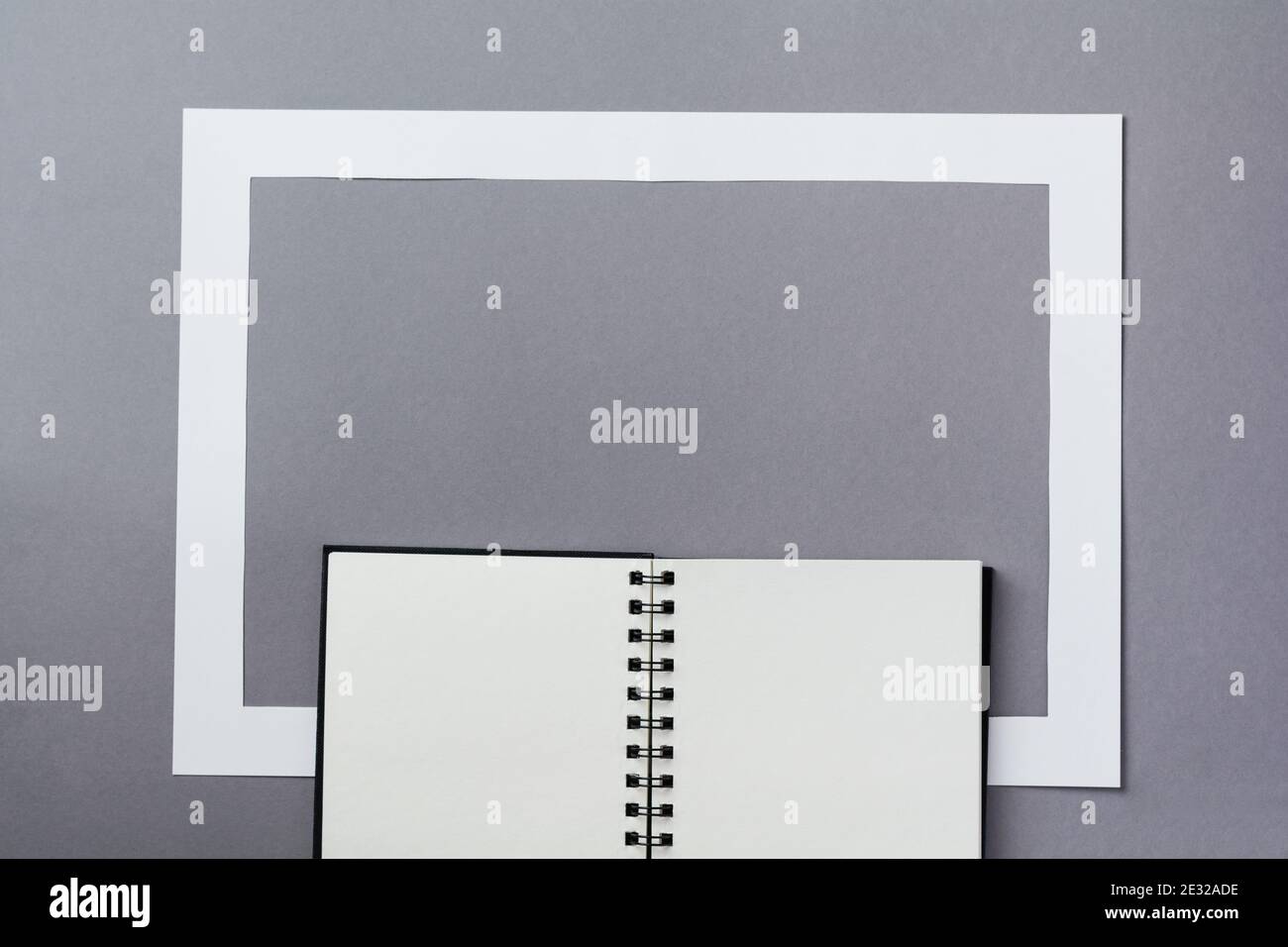 Notebook or sketchbook and paper frame on classic blue background ...