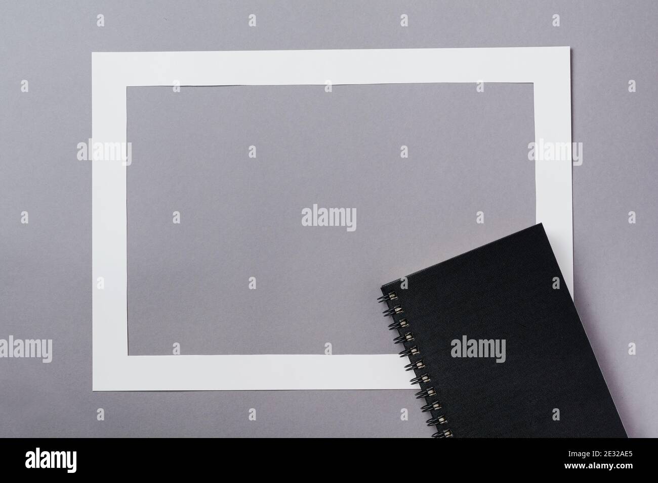 Notebook or sketchbook and paper frame on classic blue background ...