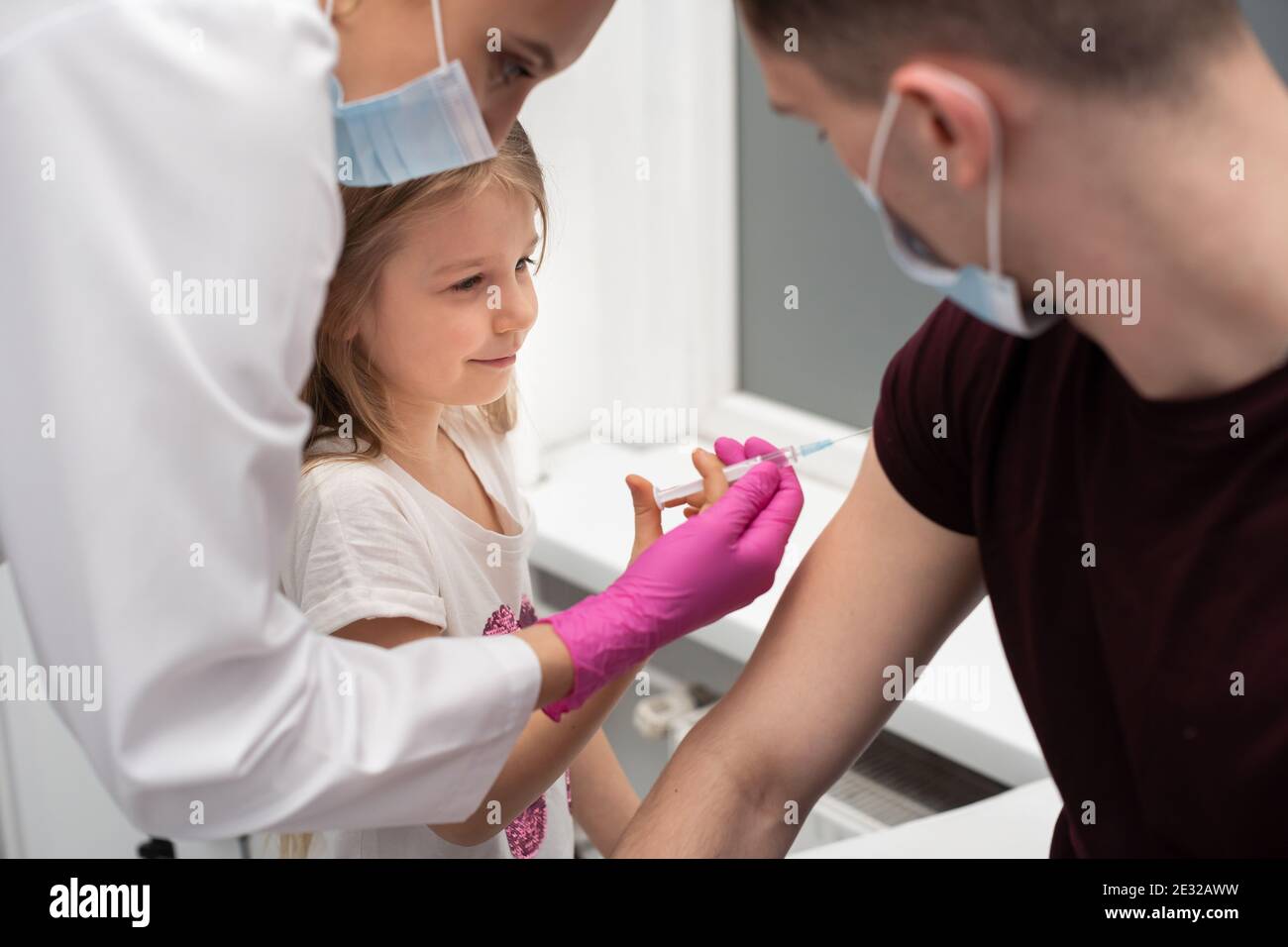 For fun, the nurse shows the girl how to administer the injections. The ...