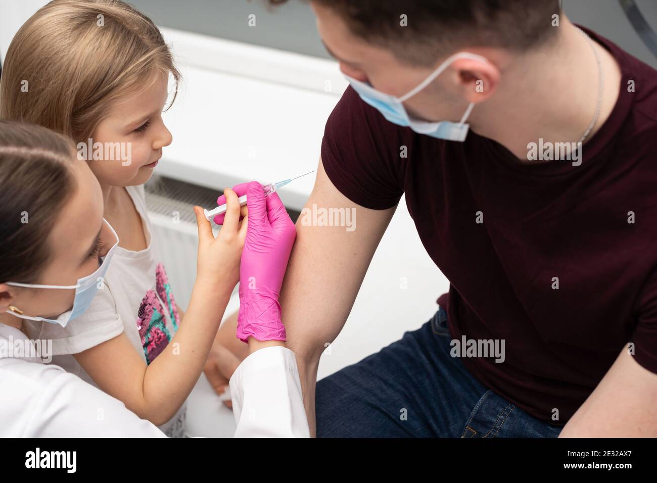 For fun, the nurse shows the girl how to administer the injections. The ...