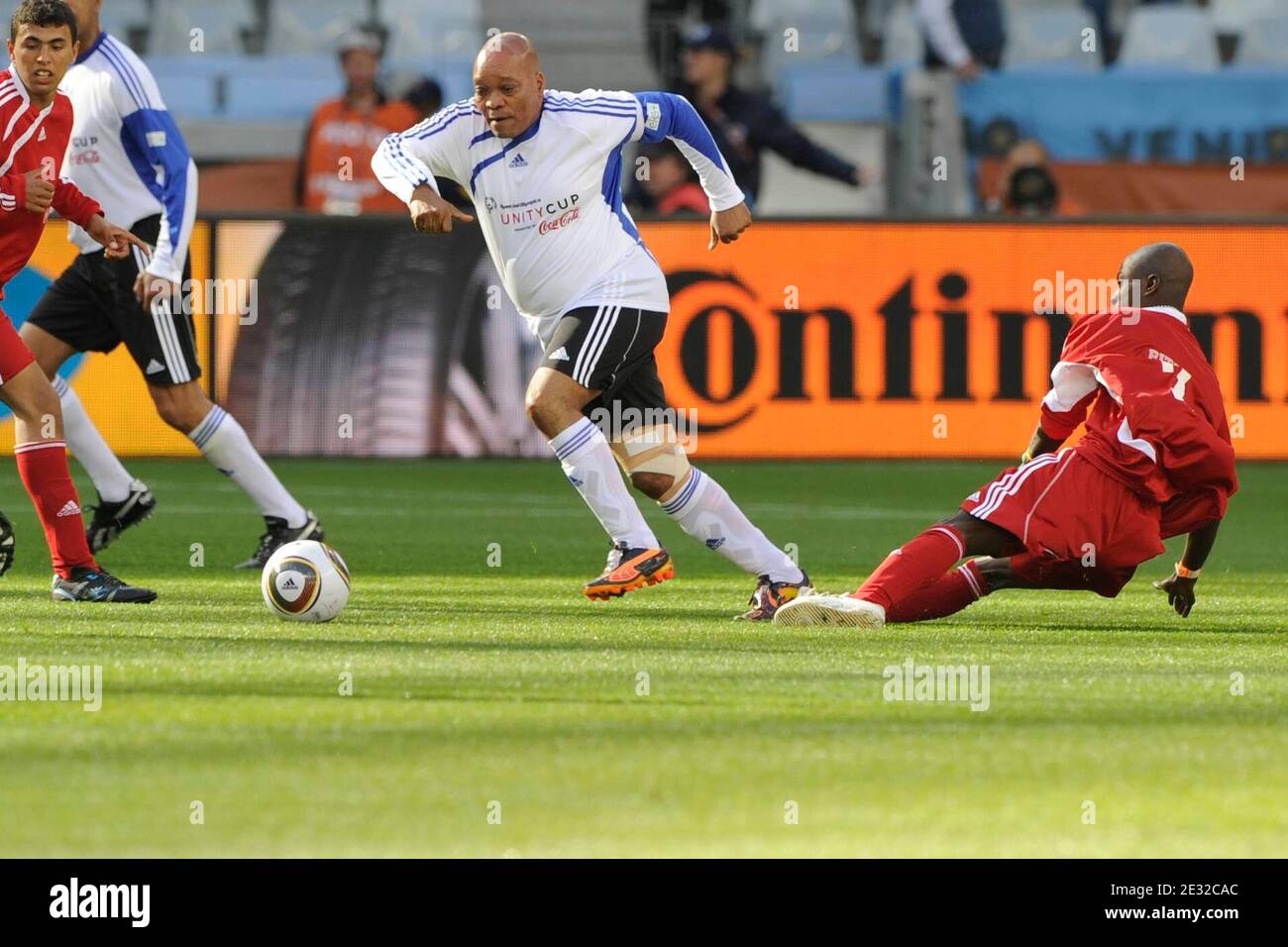 South Africa president Jacob Zuma plays football for a charity action ...