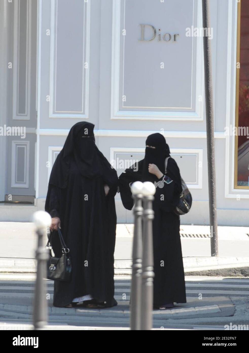 Illustration of women wearing full Islamic veil ( Burka or Niqab ) on ...