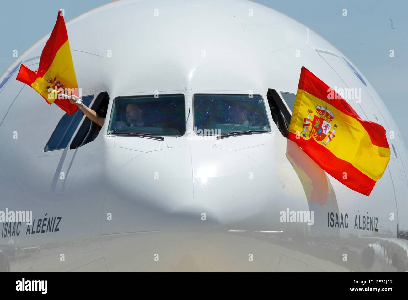 Pilots wave Spanish flags from the plane carrying the national soccer ...