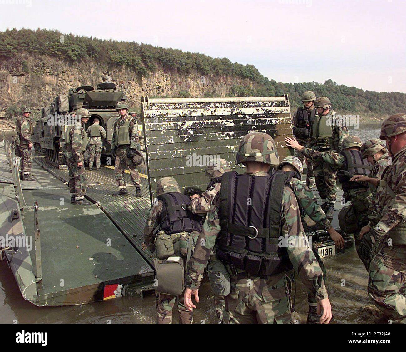 M2 Bradleys debarks a pontoon bridge Stock Photo - Alamy