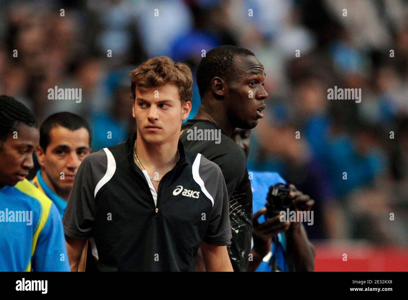 Jamaica's Usain Bolt and Asafa Powell running the 100 meters with ...