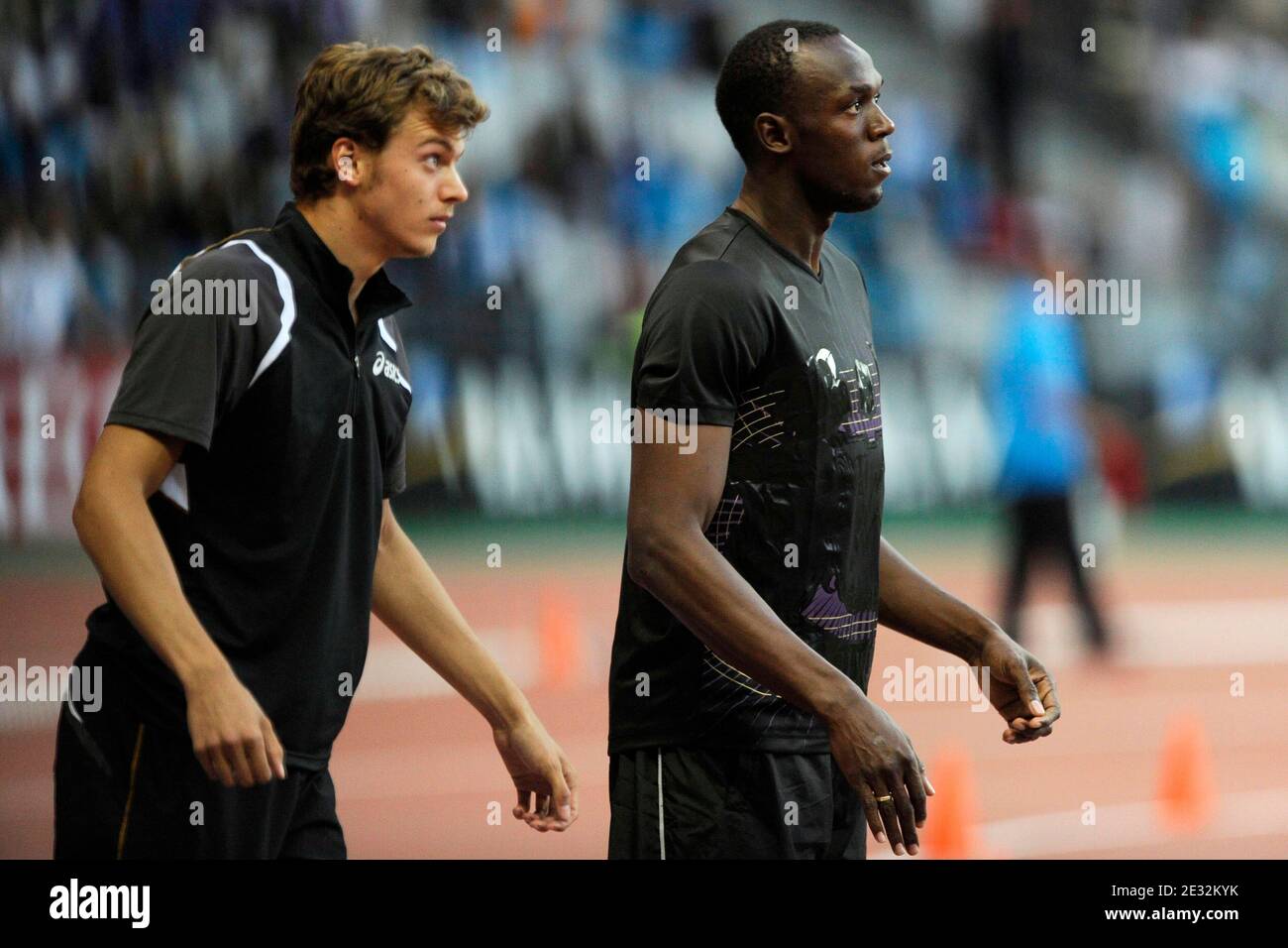 Jamaica's Usain Bolt and Asafa Powell running the 100 meters with ...