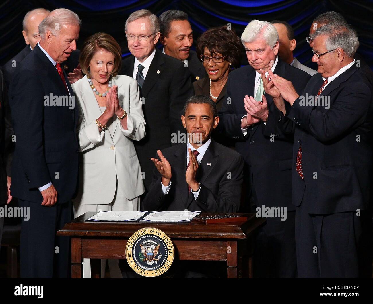 U.S. President Barack Obama signs the Dodd-Frank Wall Street Reform and ...