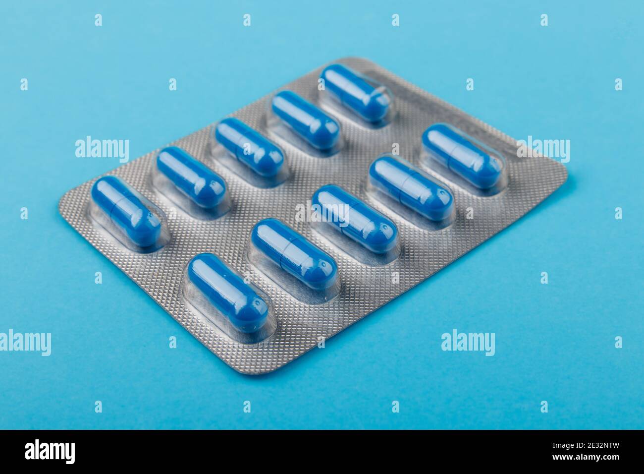 Pharmacy theme, blue pills in capsules, blue background, medicine Stock ...