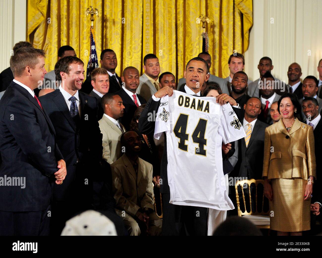 United States President Barack Obama holds up a jersey presented to him ...