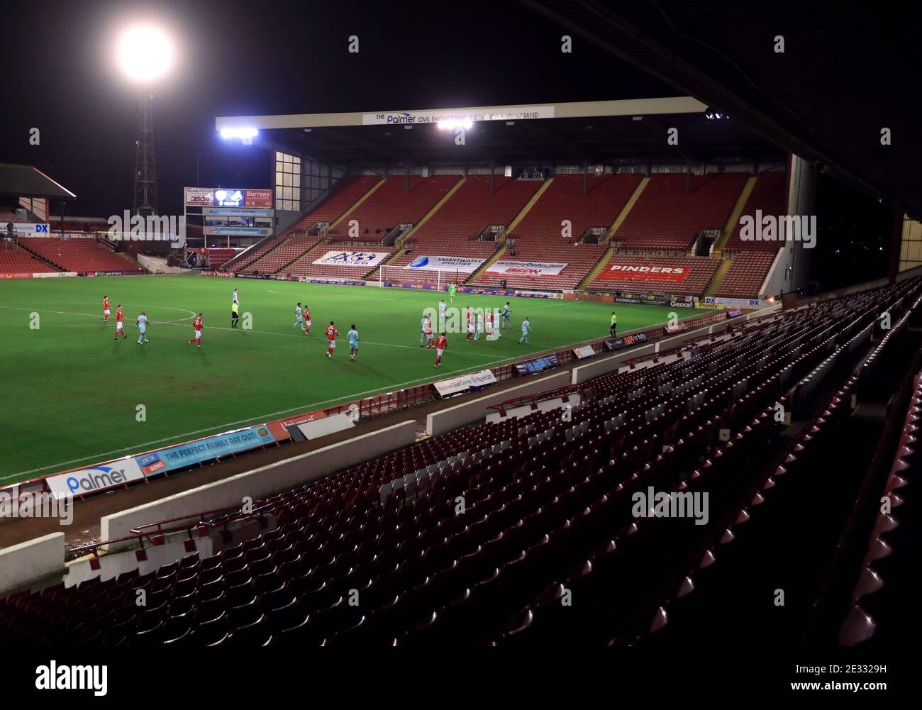 General view of the action on the pitch in front of empty stands at ...