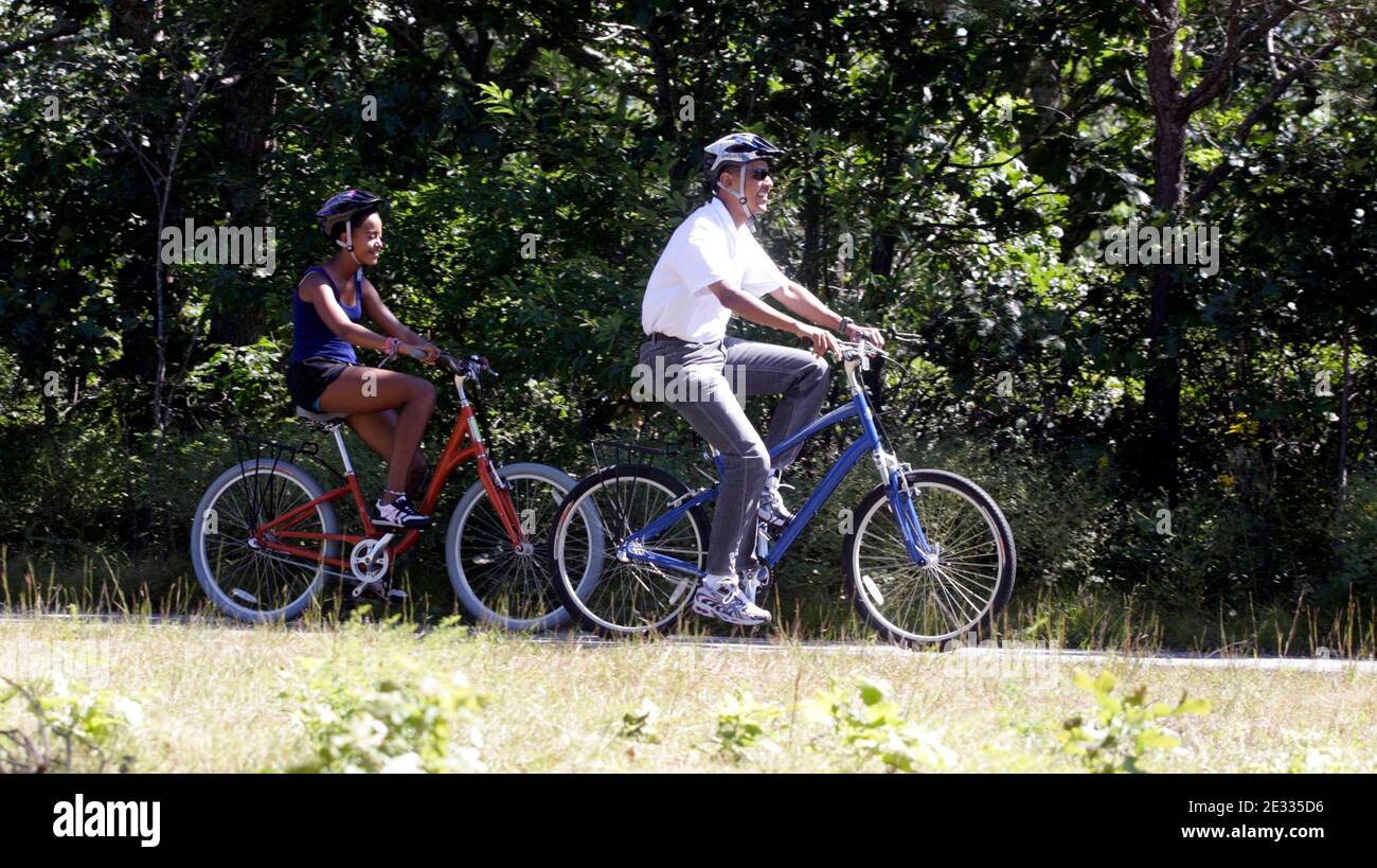 Malia Obama trails President Barack Obama during a family bike ride ...