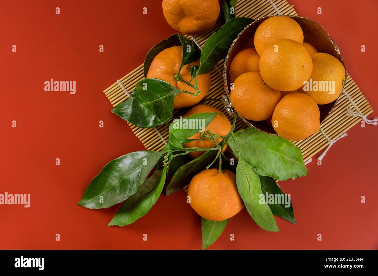 Mandarin orange fruit in basket with isolated red background Stock ...