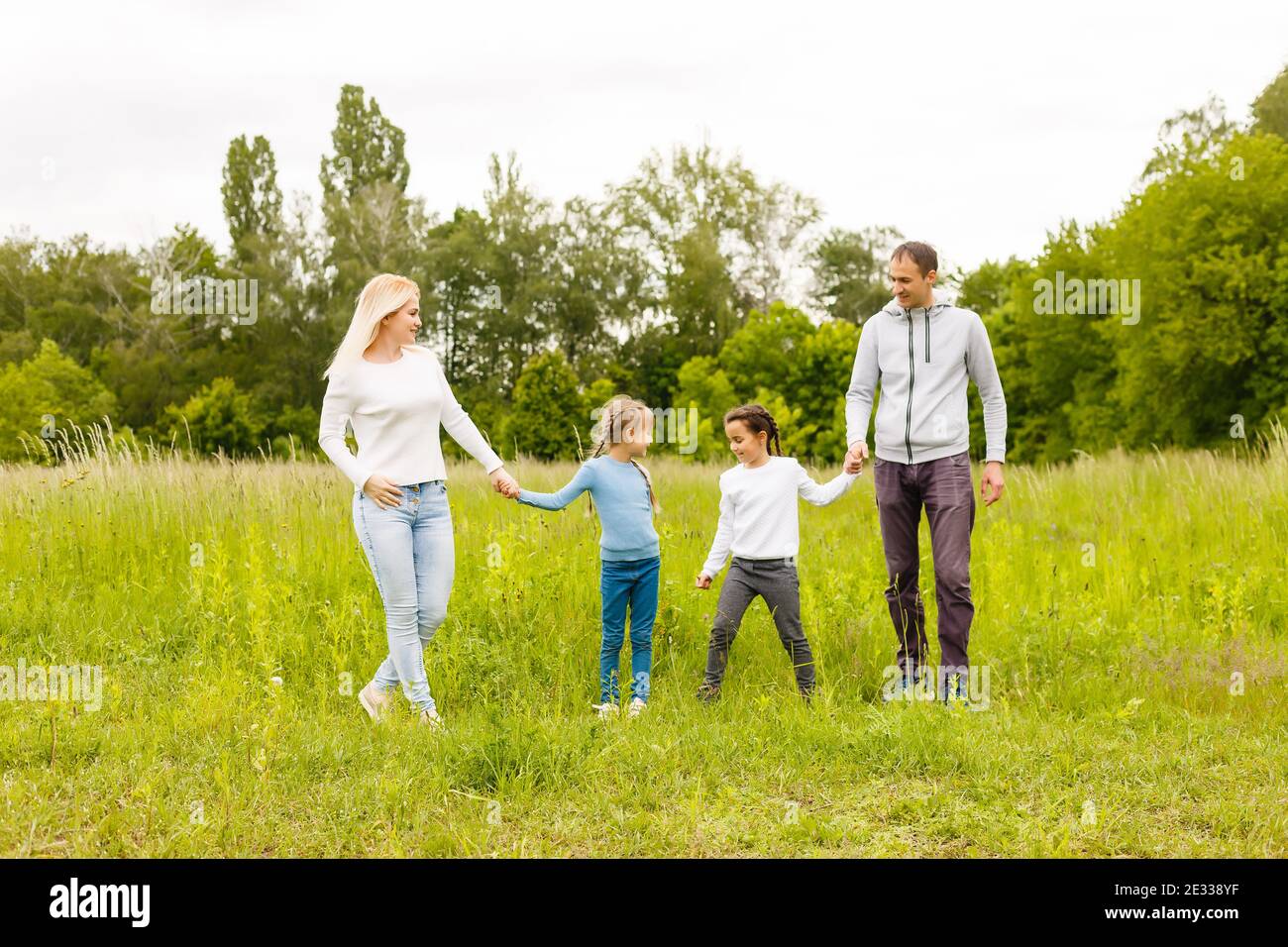 Woman two children enjoying walk hi-res stock photography and images ...
