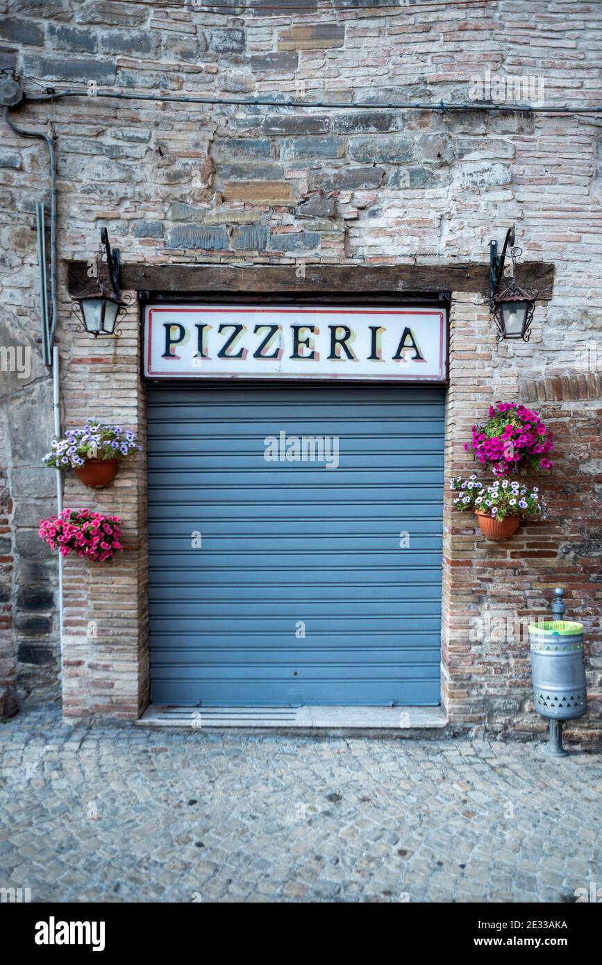 Closed Italian pizzeria in an Italian town. Traditional Italian ...